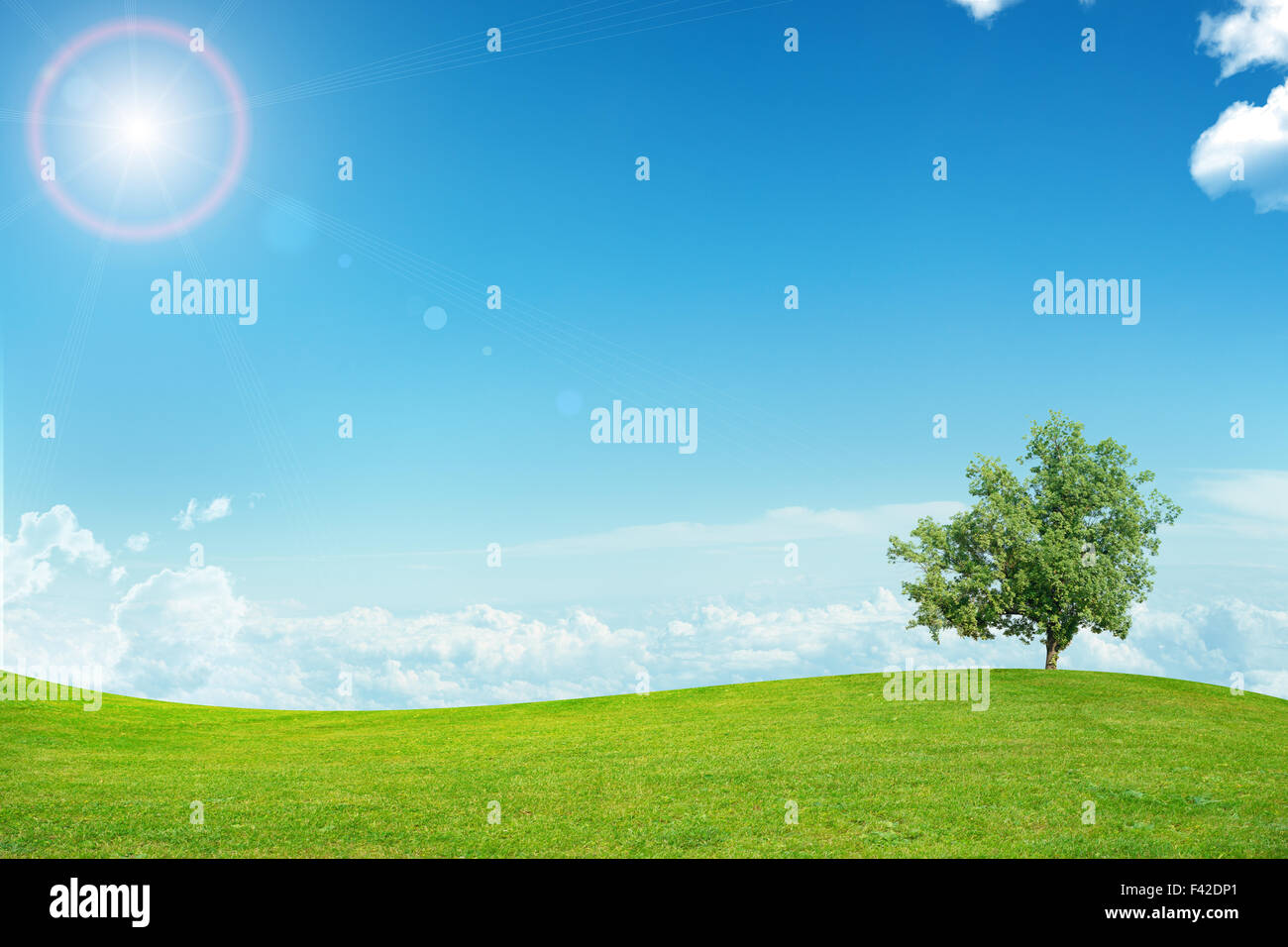 Landscape with blue sky and sun Stock Photo - Alamy