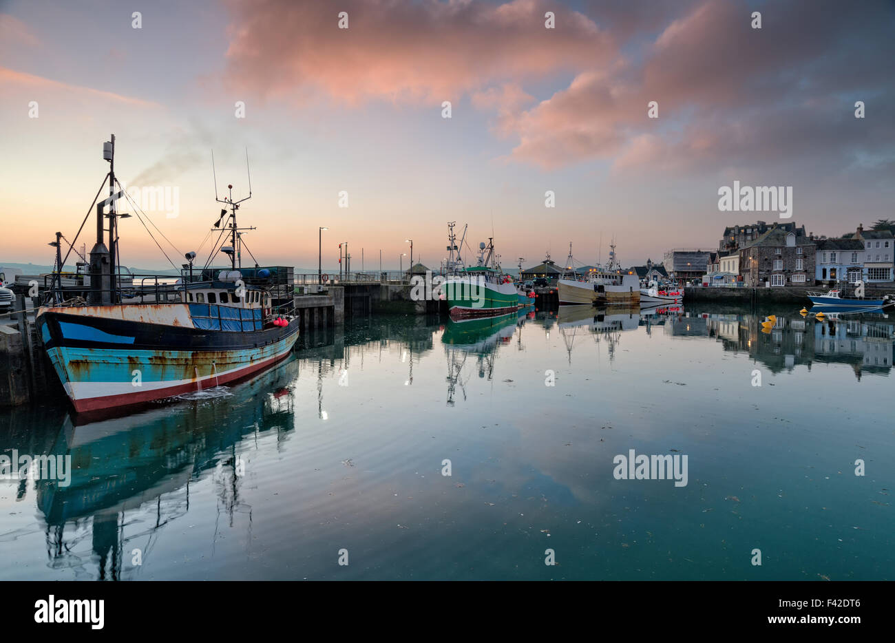 Dawn over fishing boats in the harbour at Padstow on the north Cornwall ...