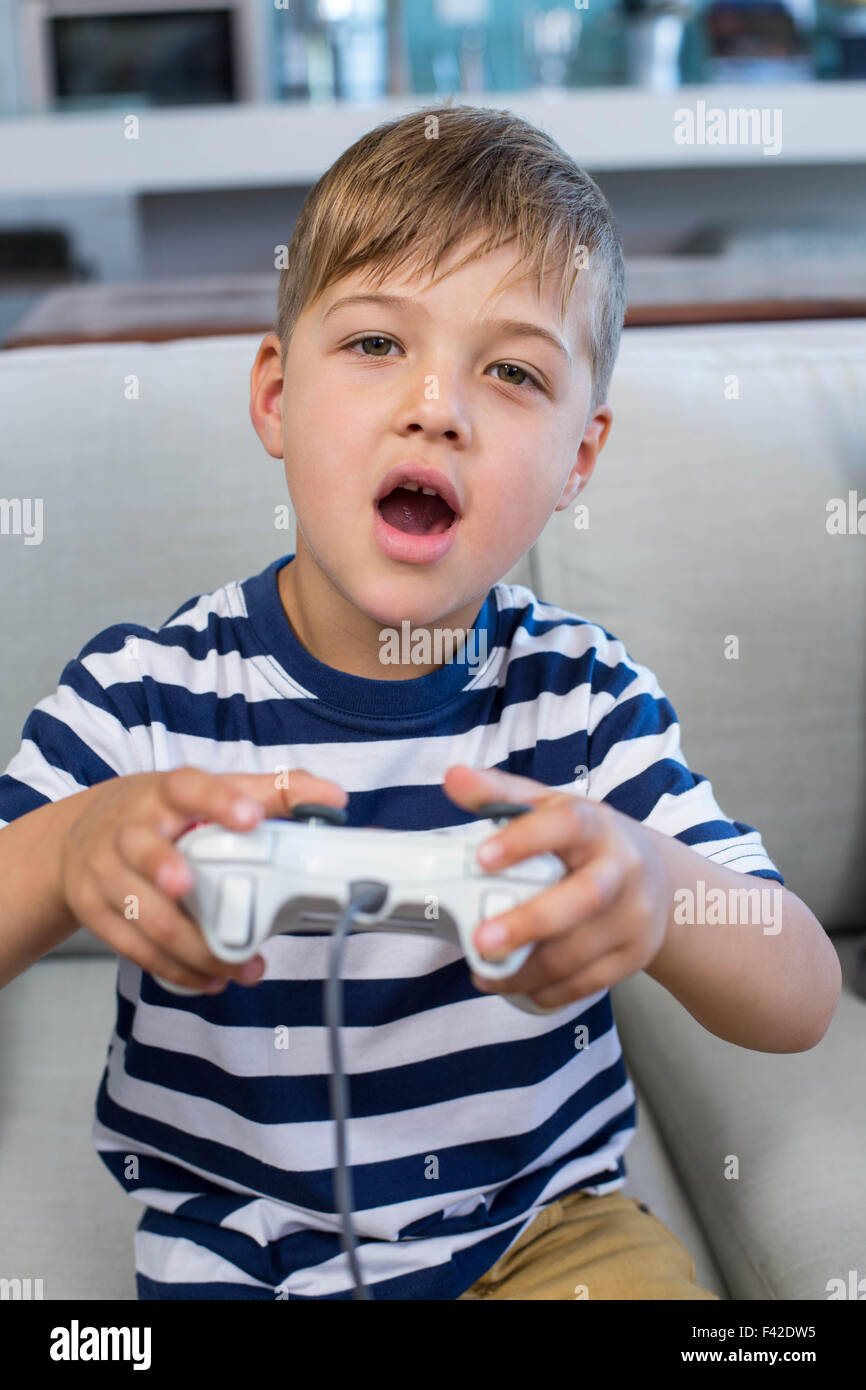 Little boy playing video games Stock Photo - Alamy