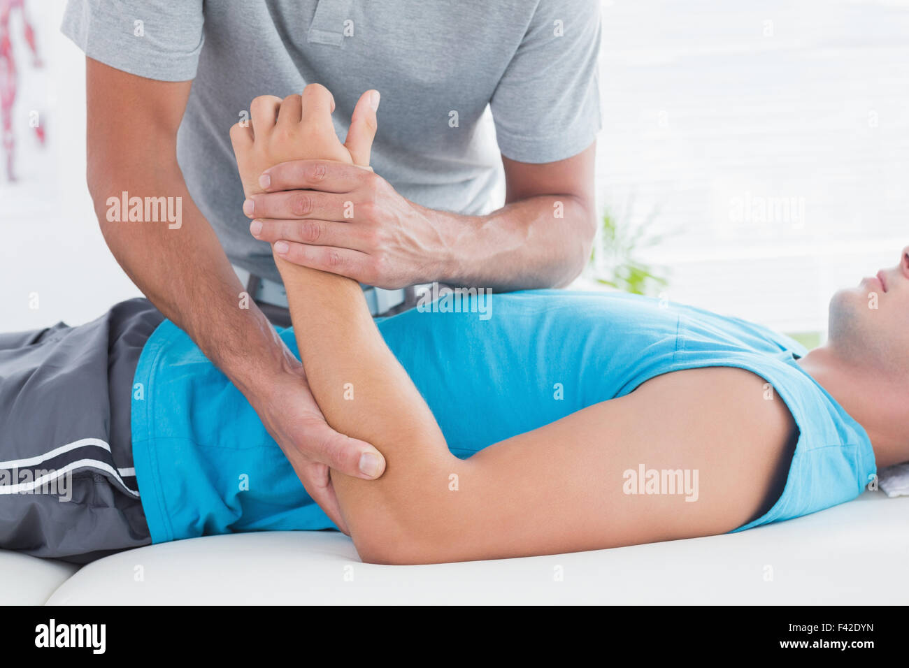 Doctor examining his patient arm Stock Photo - Alamy