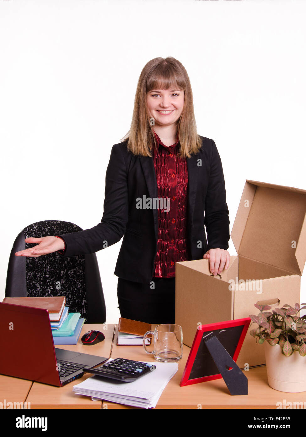 Girl in the office gets a new workplace Stock Photo - Alamy