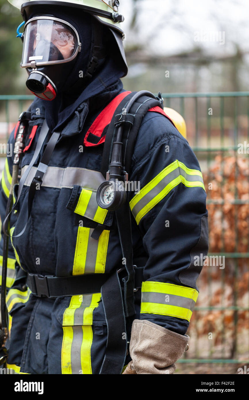 Fireman with equipment Stock Photo - Alamy