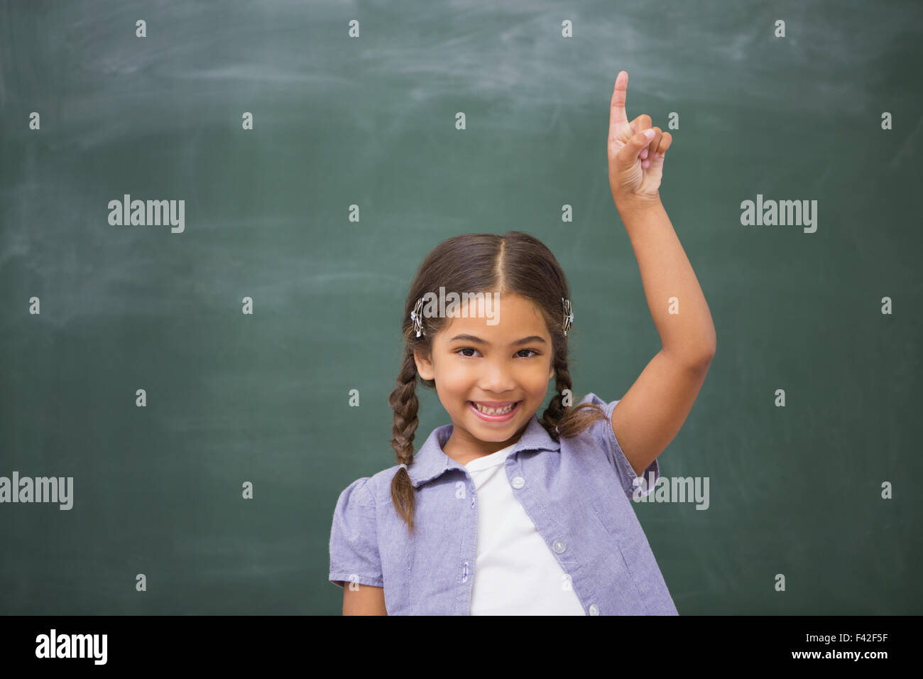 Girl class raising hand back hi-res stock photography and images - Alamy
