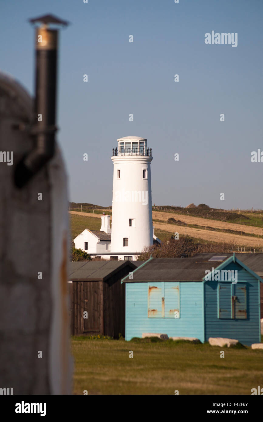 Old lighthouse at Portland Bill with beach huts, Dorset in October ...