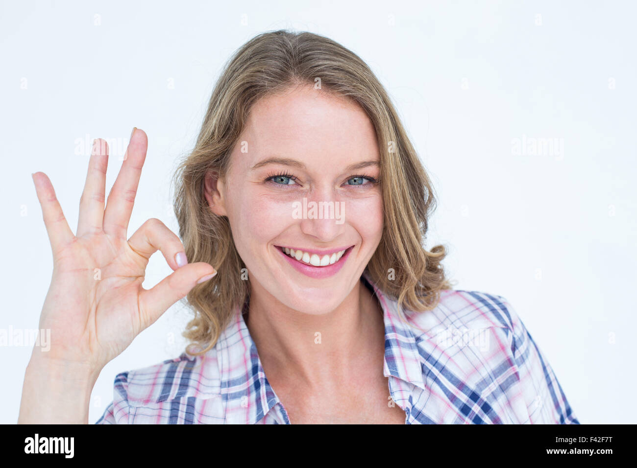 Pretty hipster doing okay sign Stock Photo - Alamy