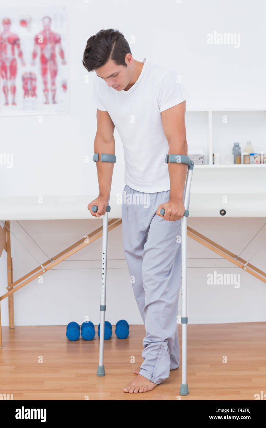 Patient walking with crutch Stock Photo - Alamy
