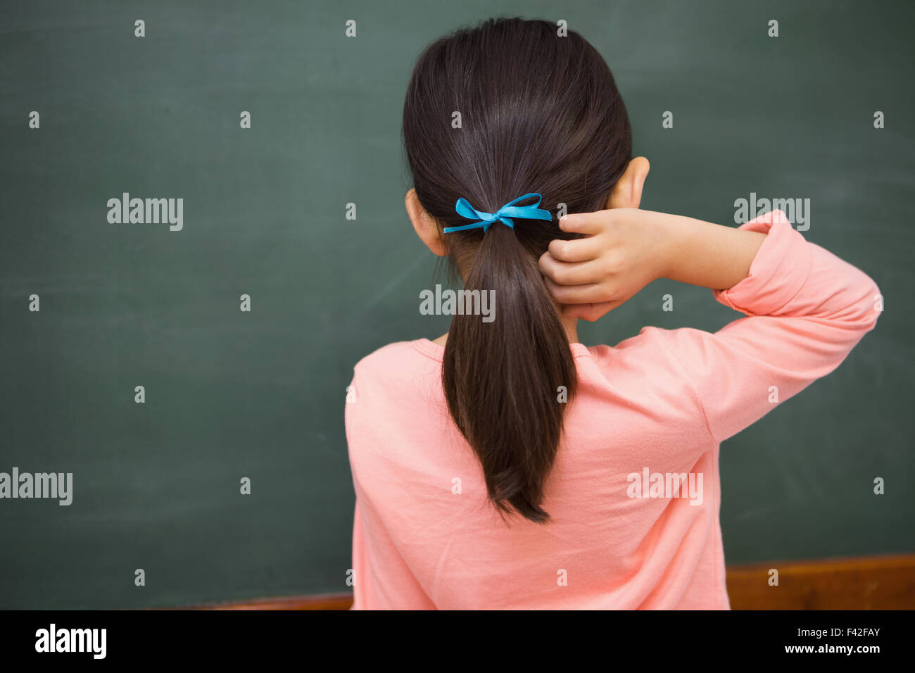 Pupil looking at board Stock Photo - Alamy