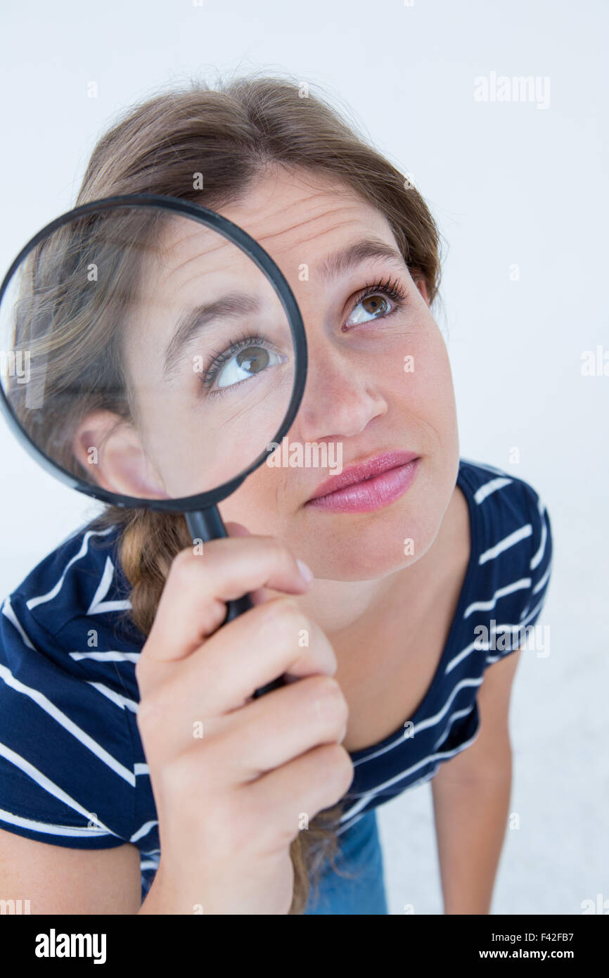 Woman holding magnifying glass Stock Photo - Alamy