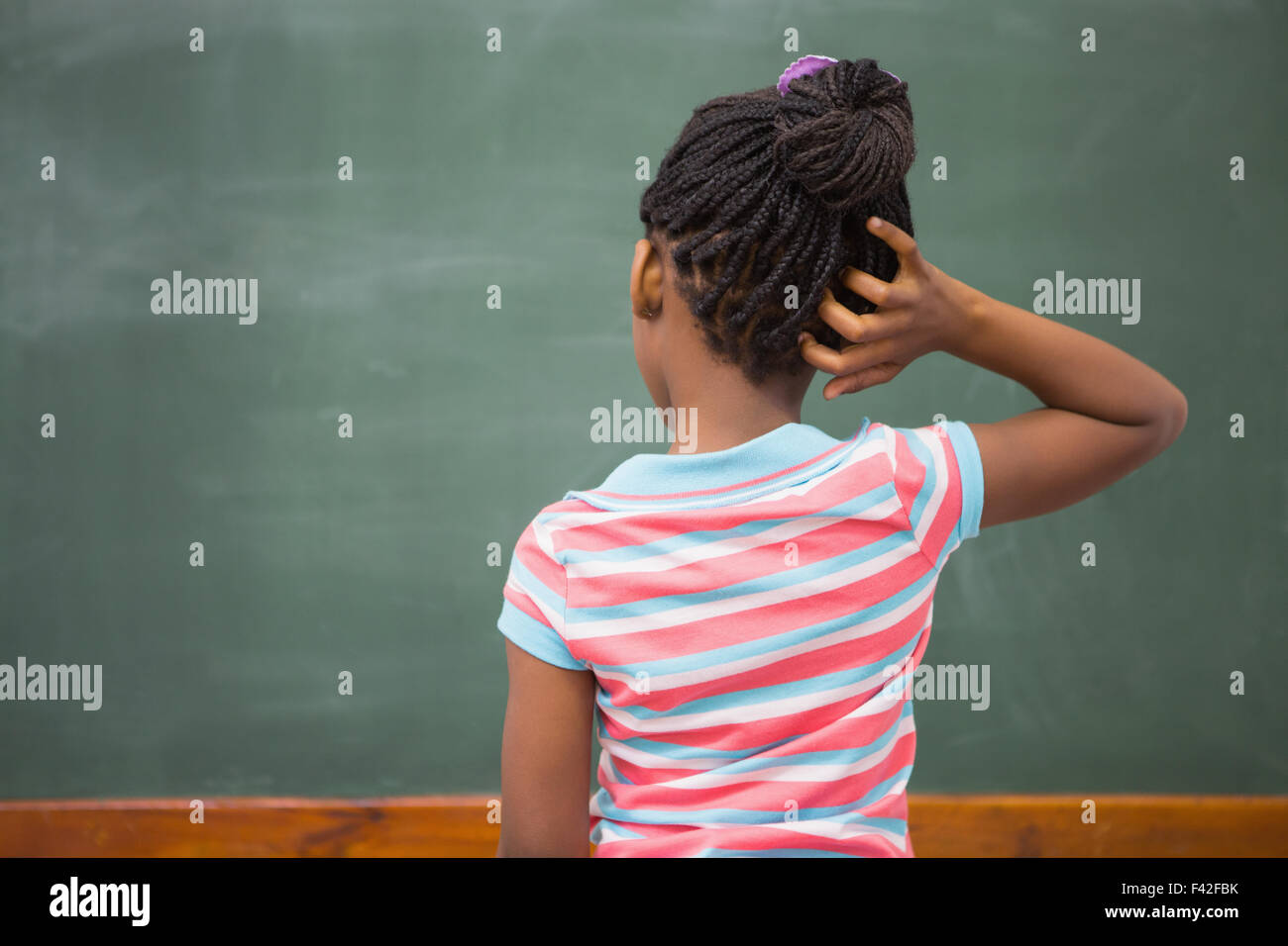 Pupil looking at board Stock Photo - Alamy