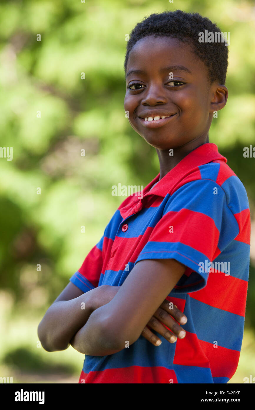 Cute little boy smiling at camera Stock Photo - Alamy