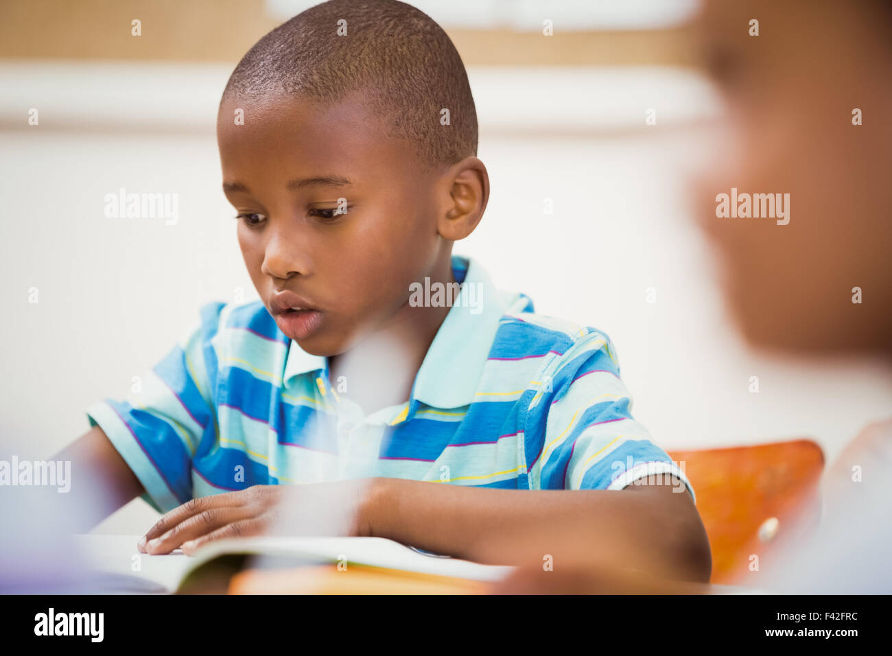 School boy working hard hi-res stock photography and images - Alamy