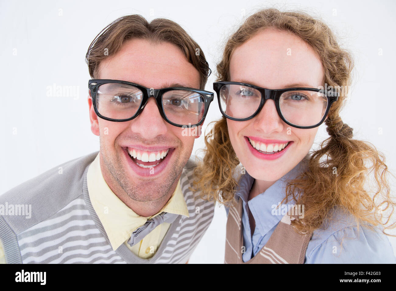 Happy geeky hipster smiling at camera Stock Photo - Alamy