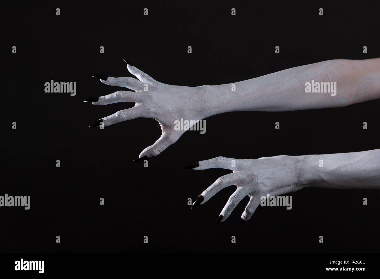 Scary pale ghost hands with black nails, body art for Halloween Stock ...