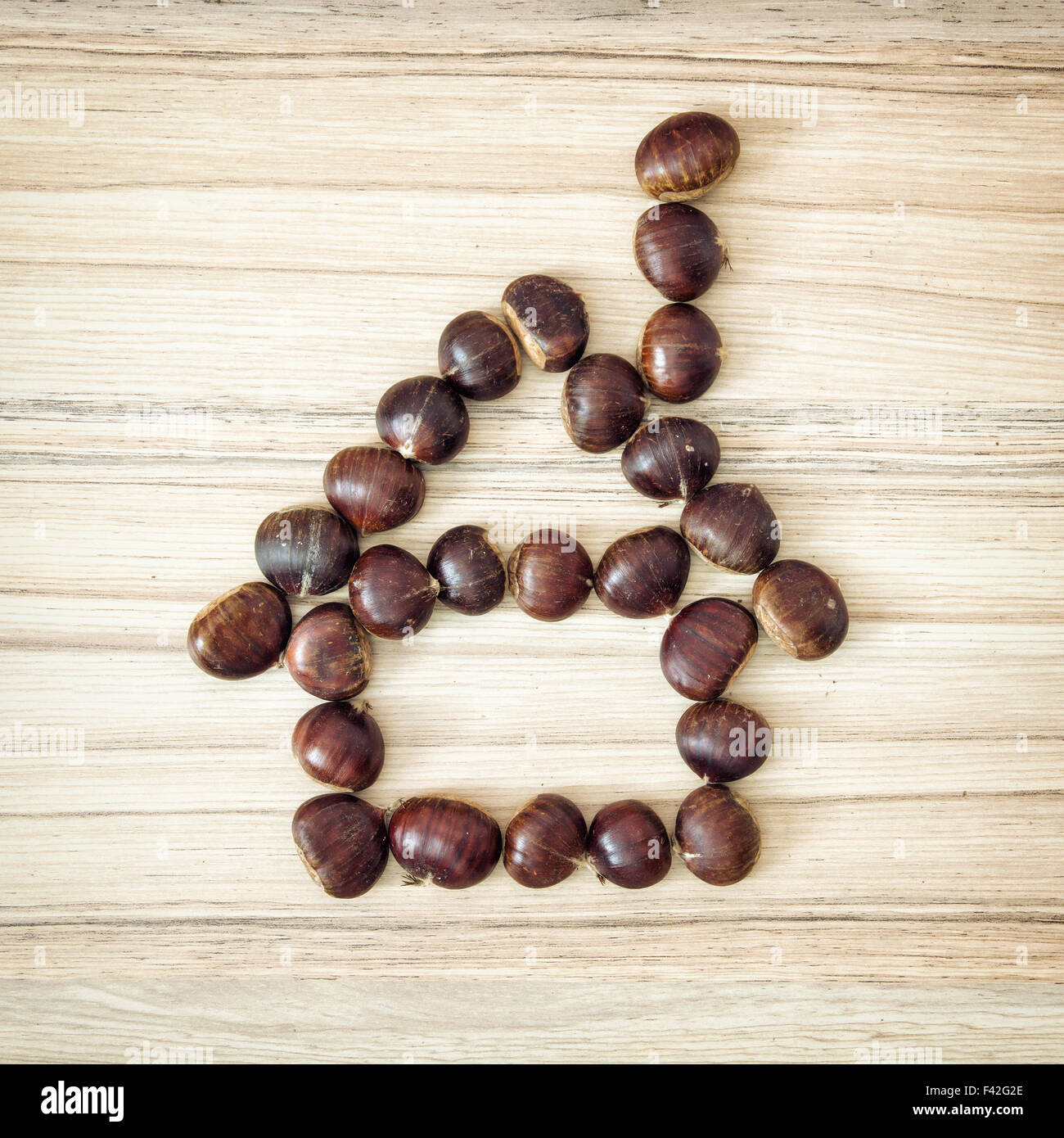 Chestnuts in the shape of house. Seasonal theme Stock Photo - Alamy