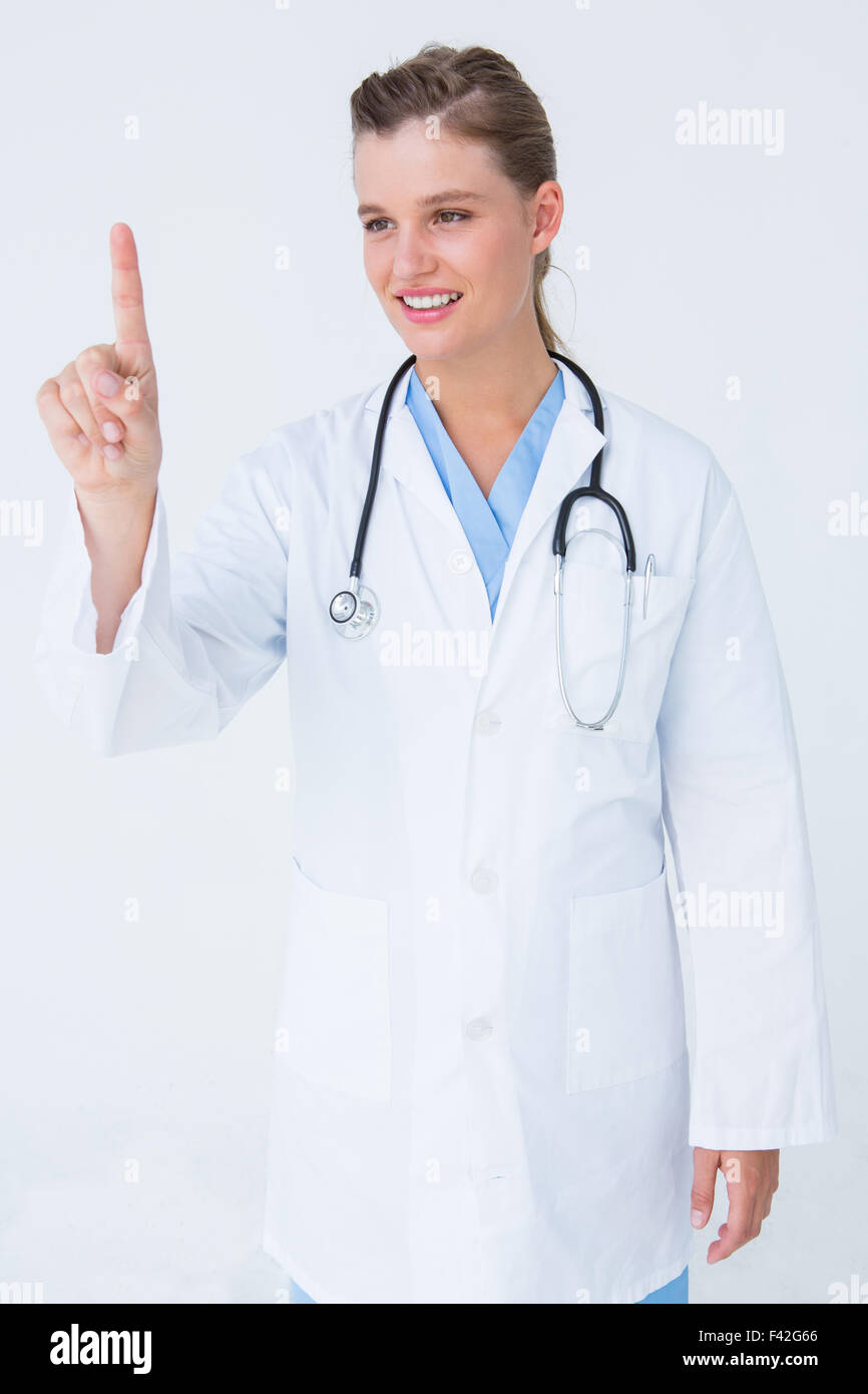 Doctor standing with finger up Stock Photo - Alamy