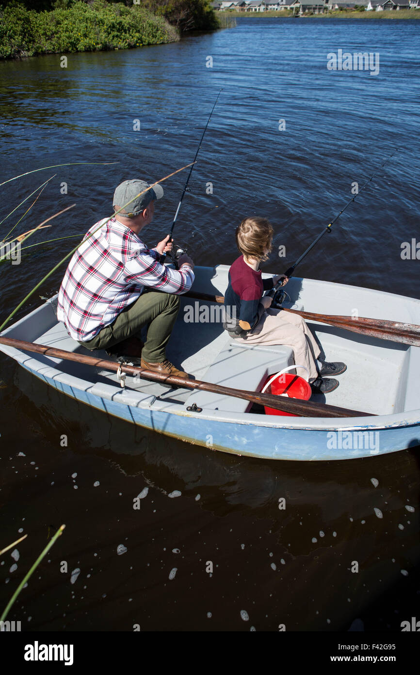 Happy man fishing with his son Stock Photo - Alamy