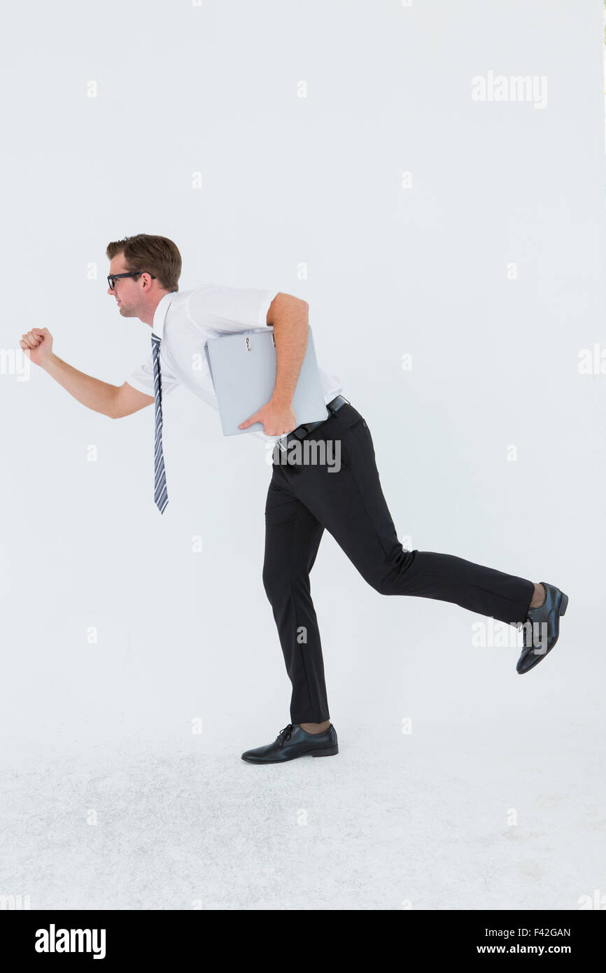 Geeky businessman running late Stock Photo - Alamy