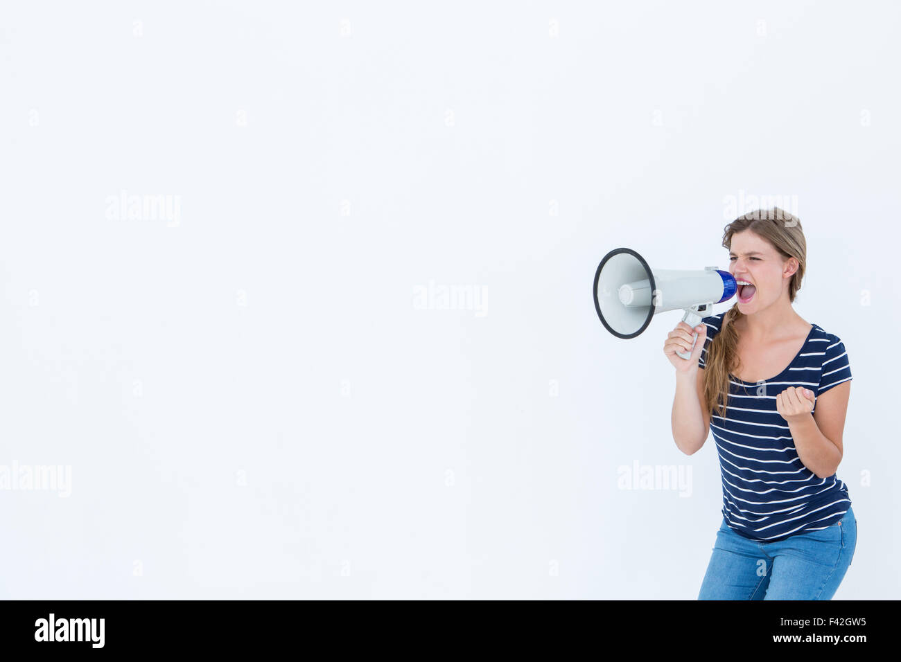 Woman shouting through a loudspeaker Stock Photo - Alamy