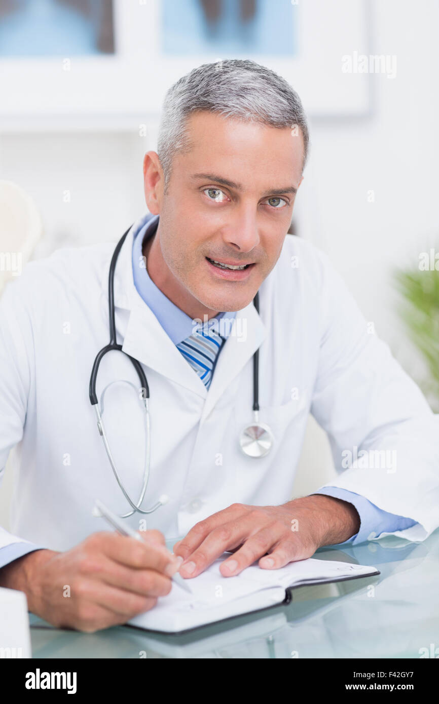 Doctor writing on diary hi-res stock photography and images - Alamy