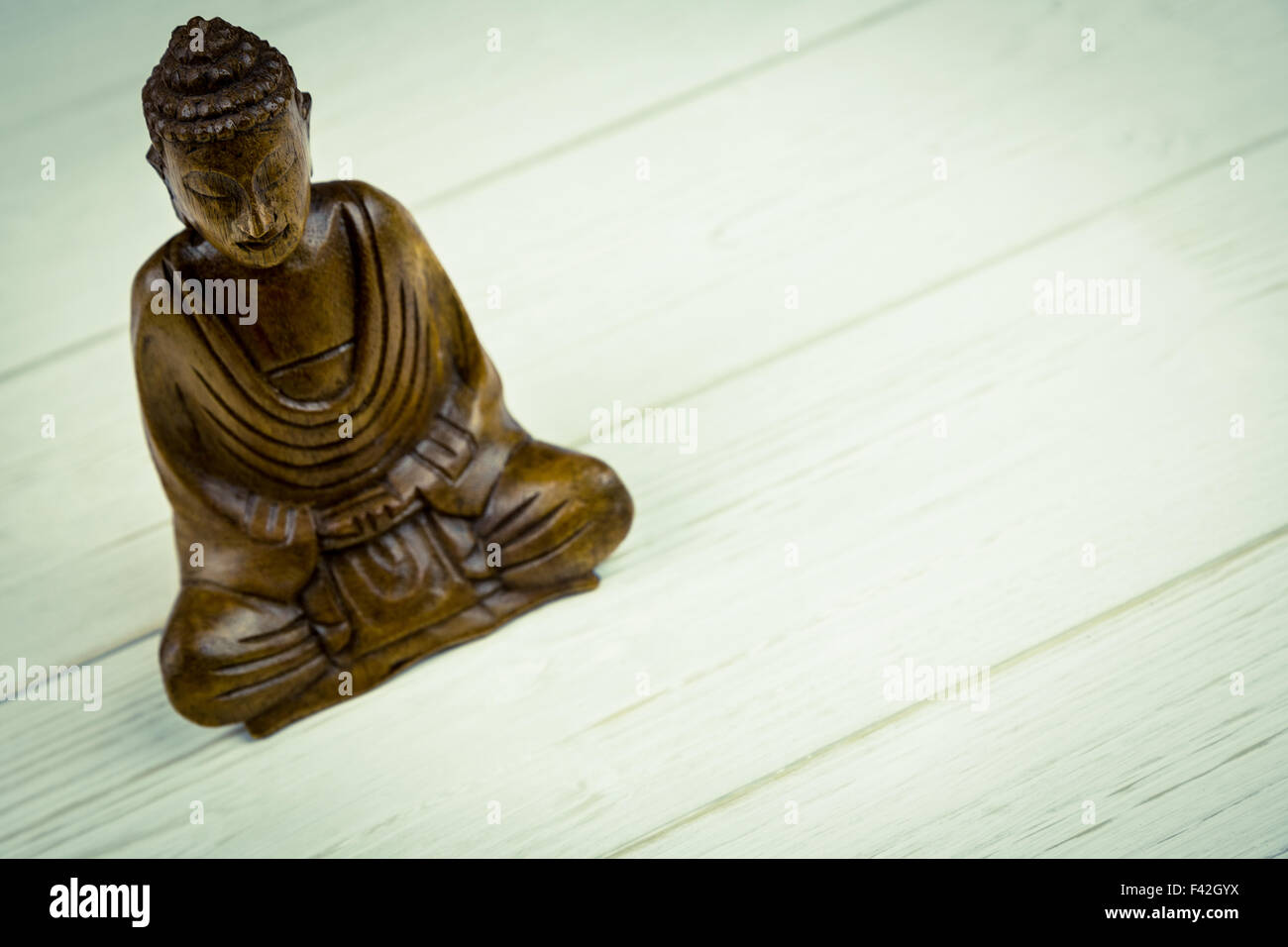 Buddha statue on a table Stock Photo - Alamy