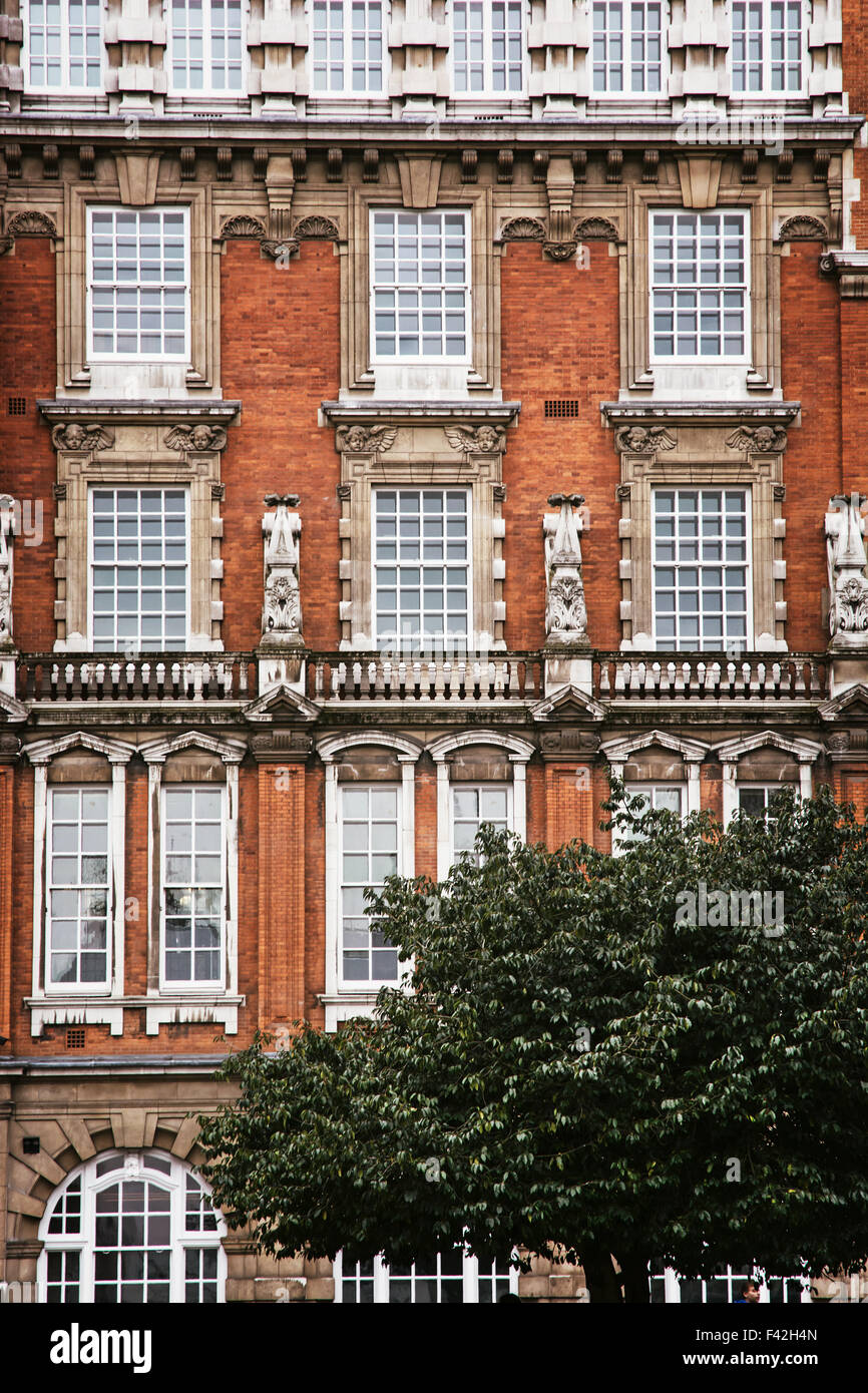 Facade of red brick building in London, Great Britain. Architectural ...