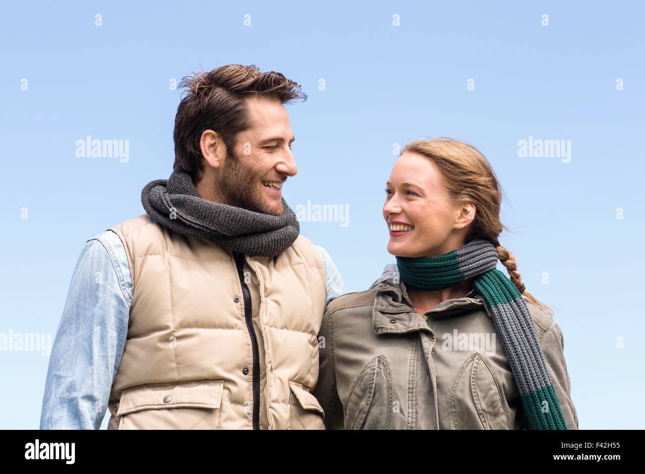 Happy couple smiling at each other Stock Photo - Alamy