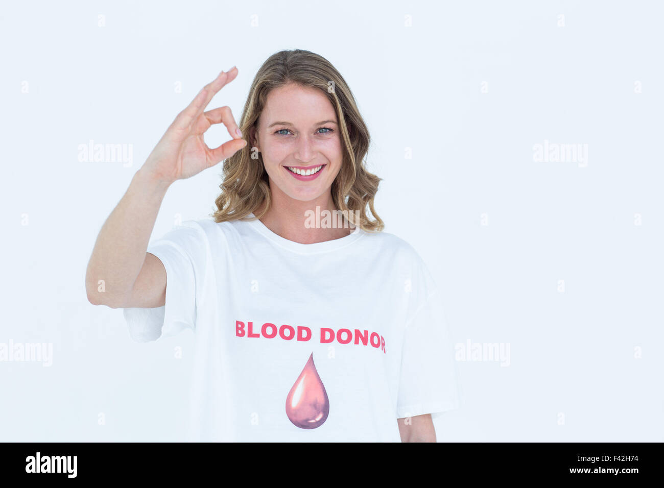 Blood donor showing okay sign Stock Photo - Alamy