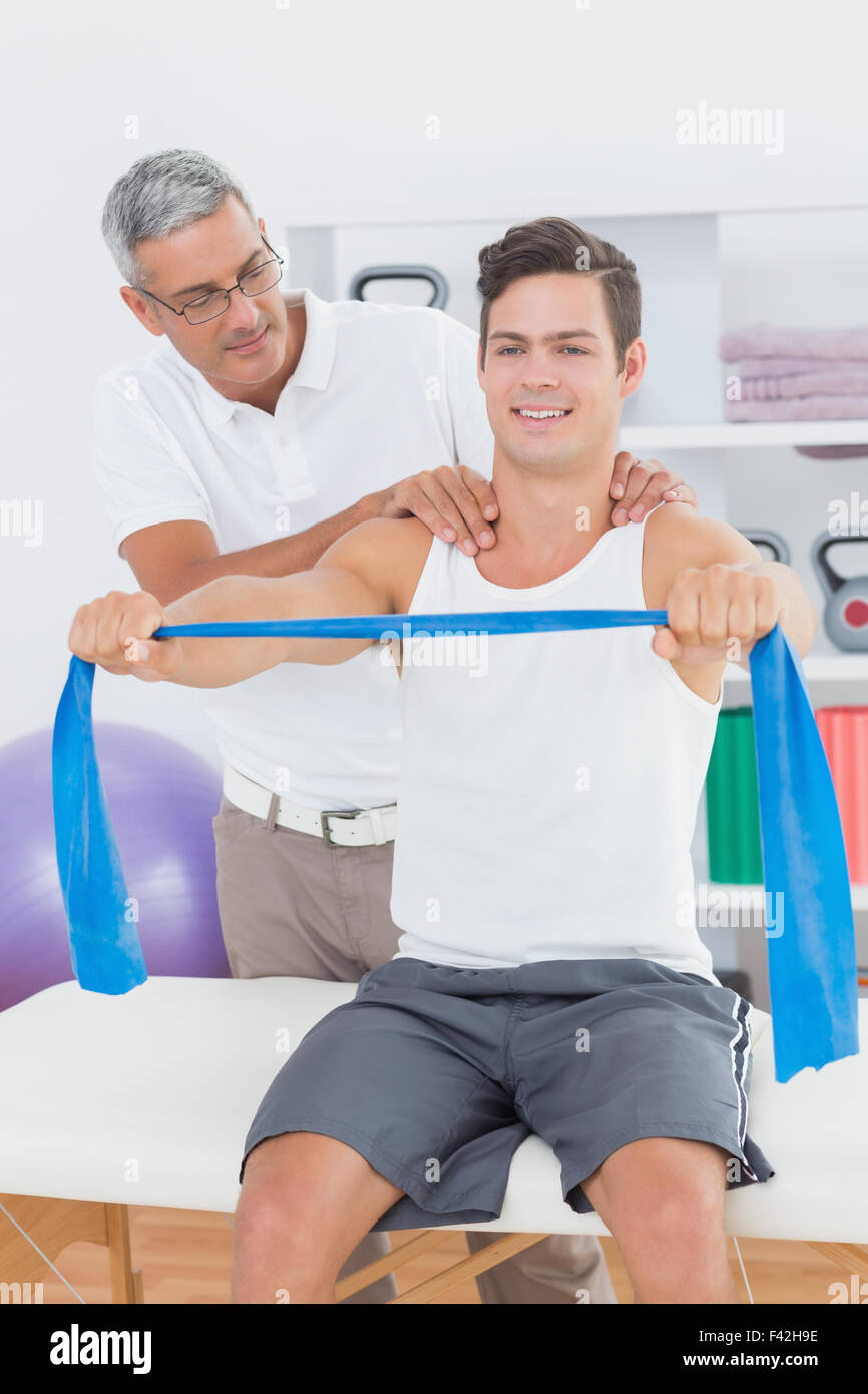 Doctor examining his patient back Stock Photo - Alamy