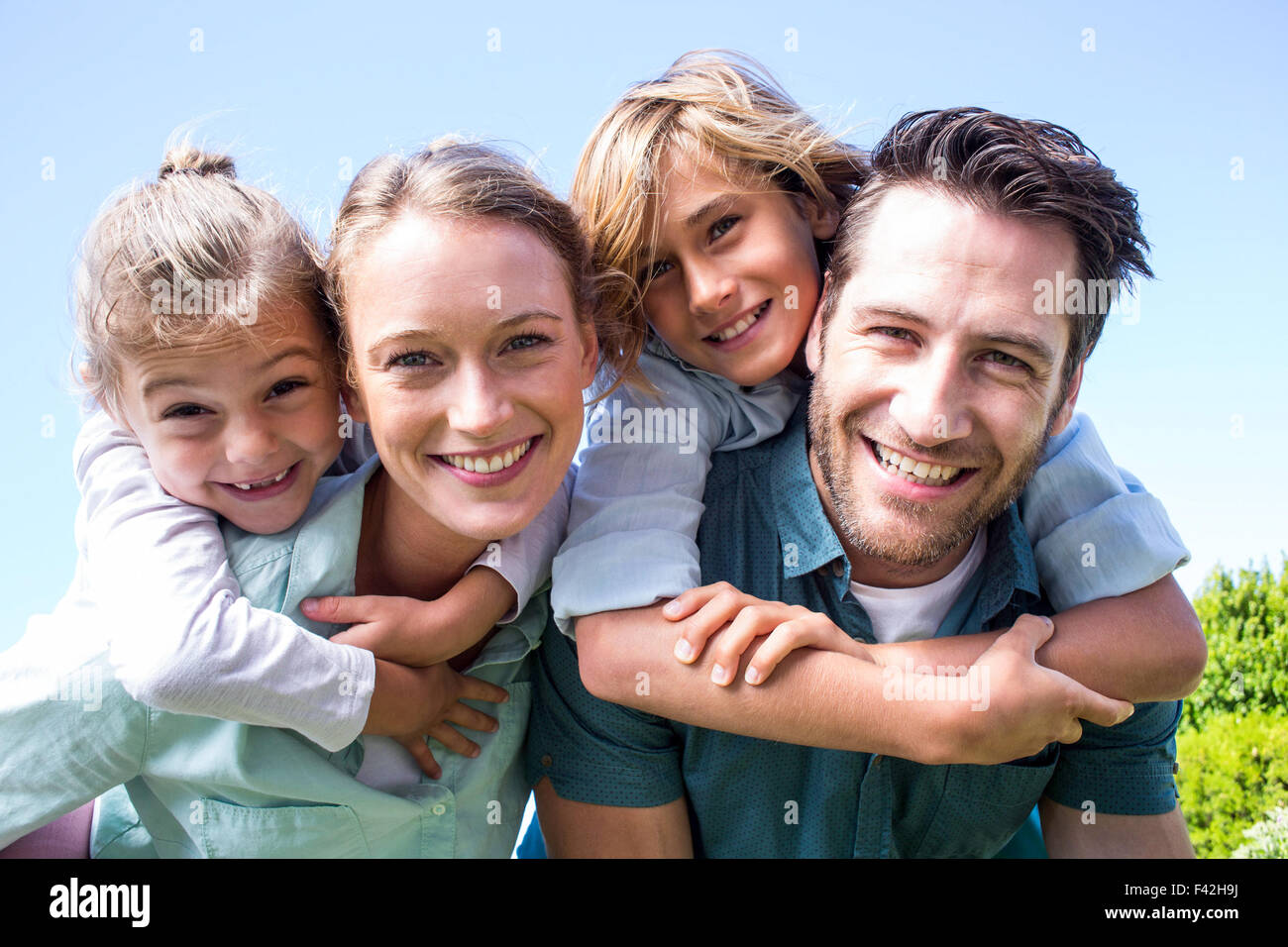 Happy parents with their children Stock Photo - Alamy