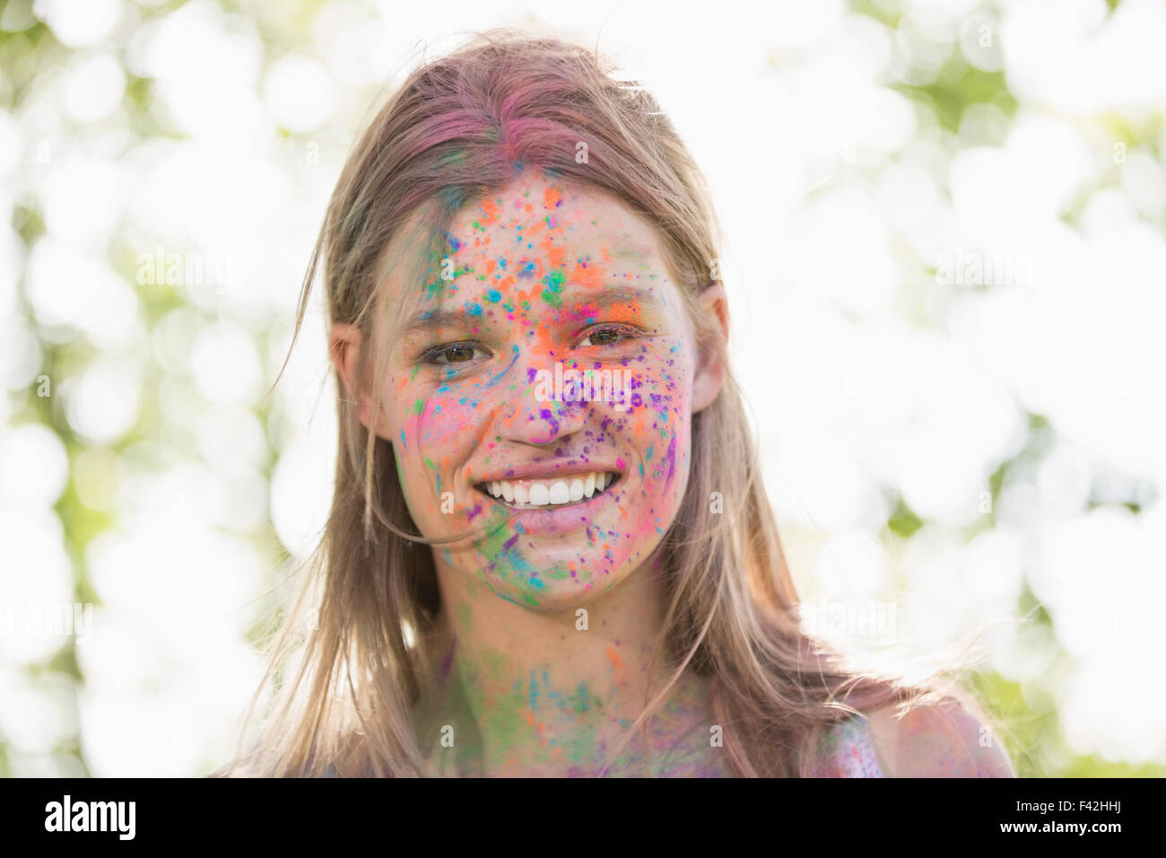 Pretty blonde covered in powder paint Stock Photo - Alamy