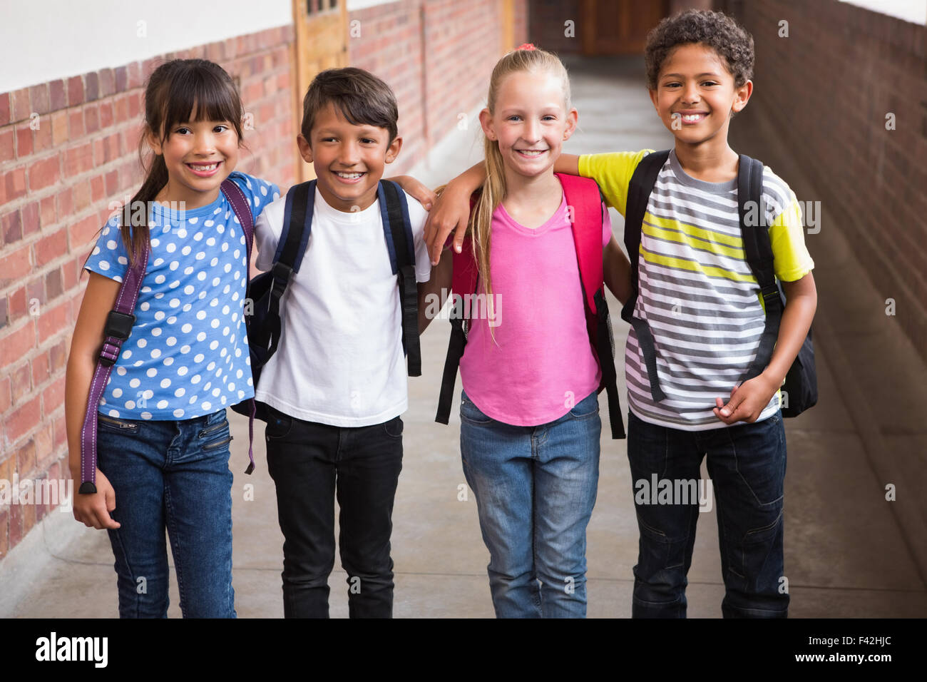Happy friends smiling at camera Stock Photo - Alamy