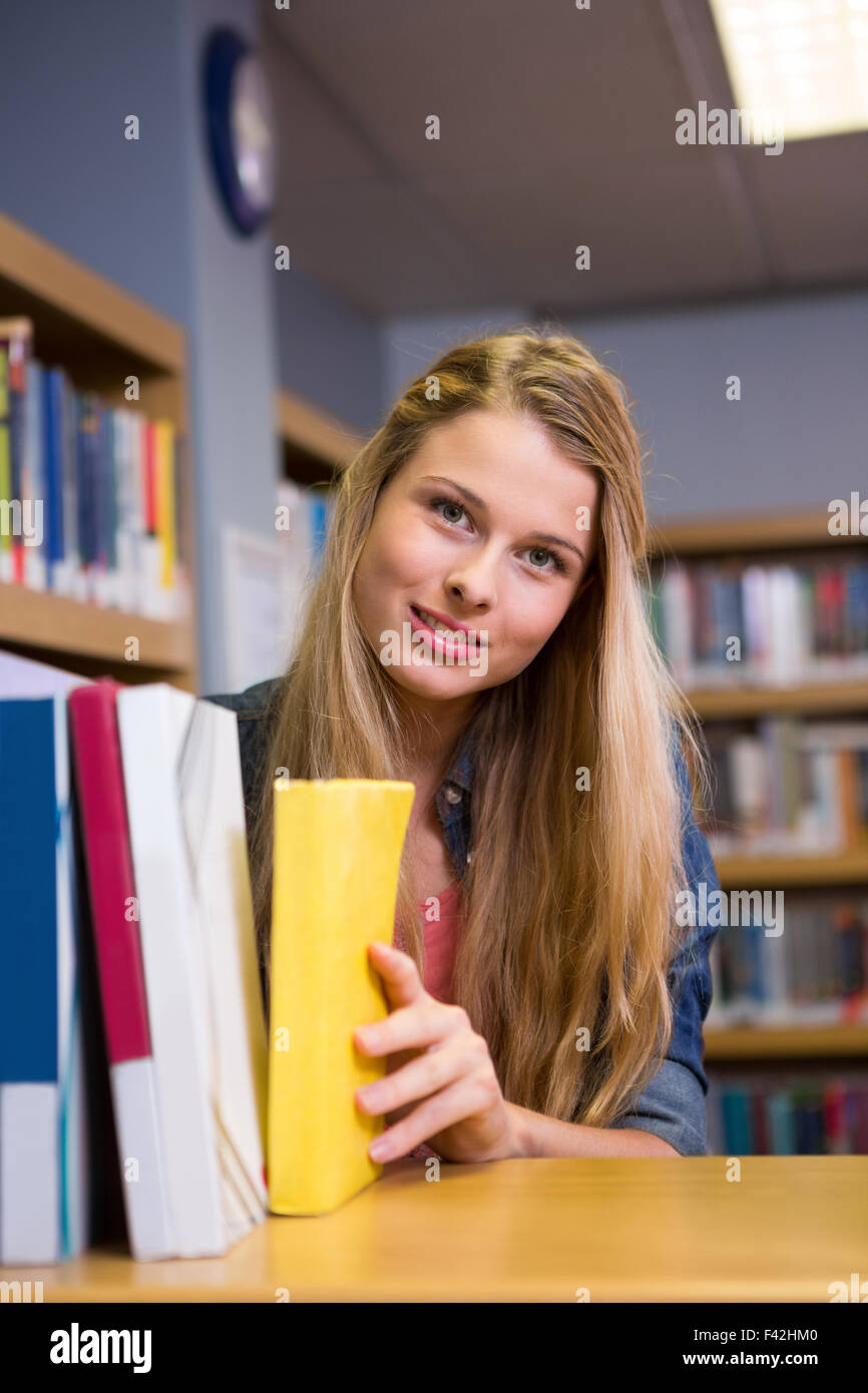 Pretty student in the library Stock Photo - Alamy