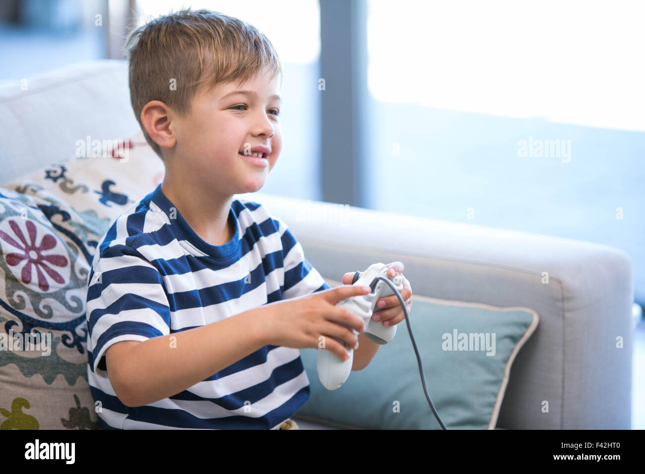 Little boy playing video games Stock Photo - Alamy