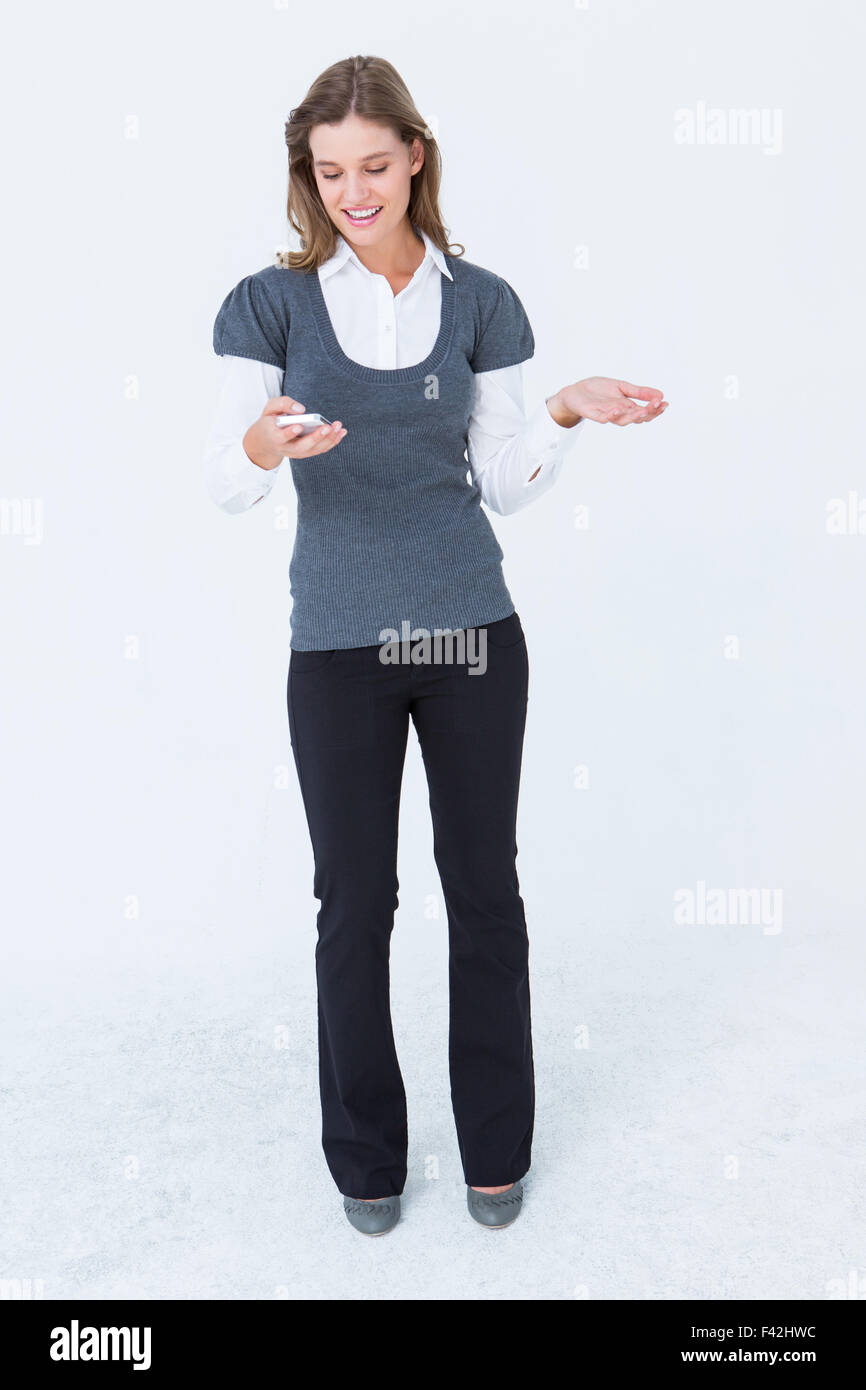 Happy woman holding her smartphone Stock Photo - Alamy