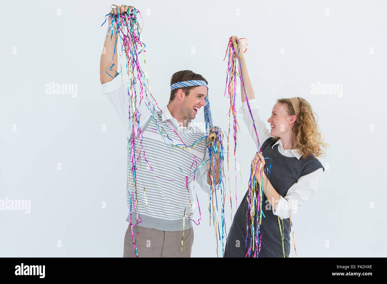 Happy geeky couple dancing Stock Photo - Alamy