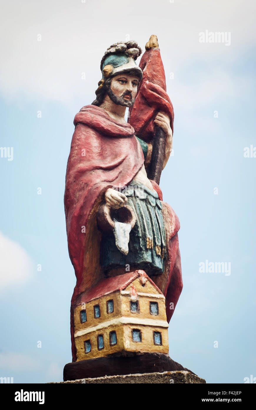 Stone statue of man with the flag and keys. Nitra, Slovakia, central ...