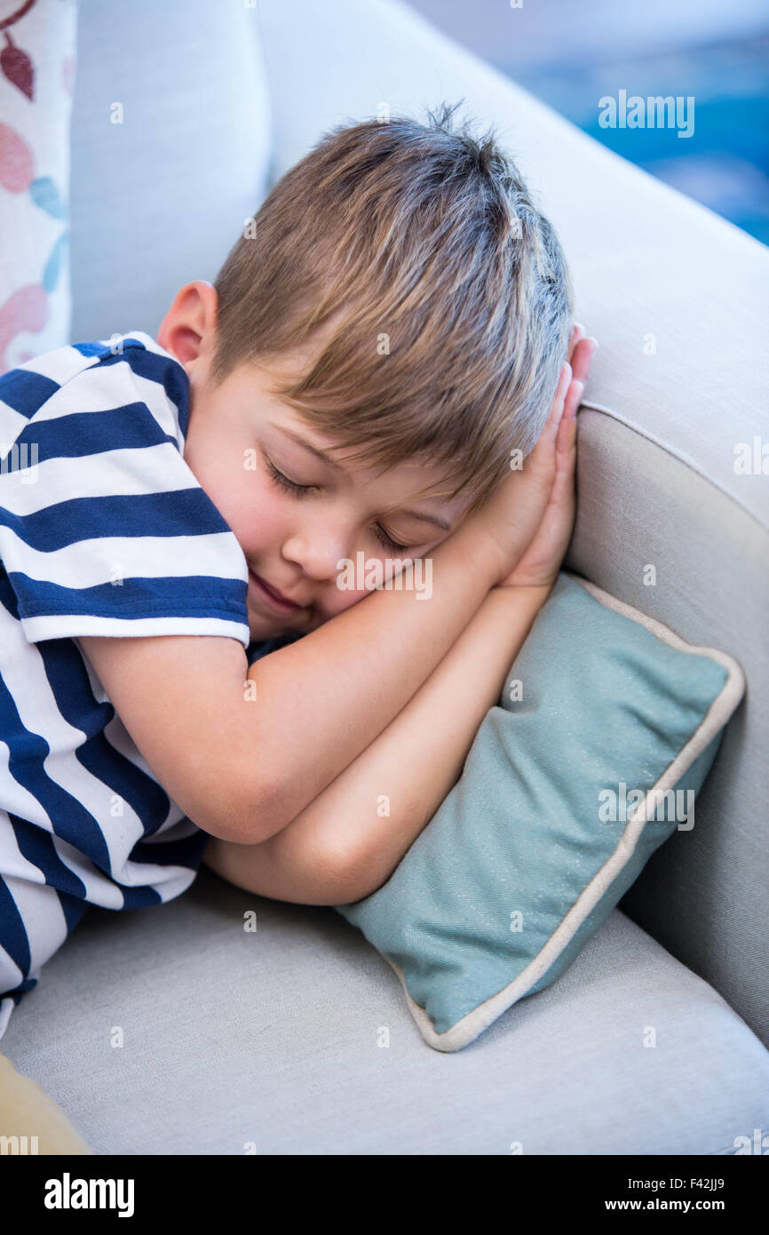 Little boy sleeping on the couch Stock Photo - Alamy