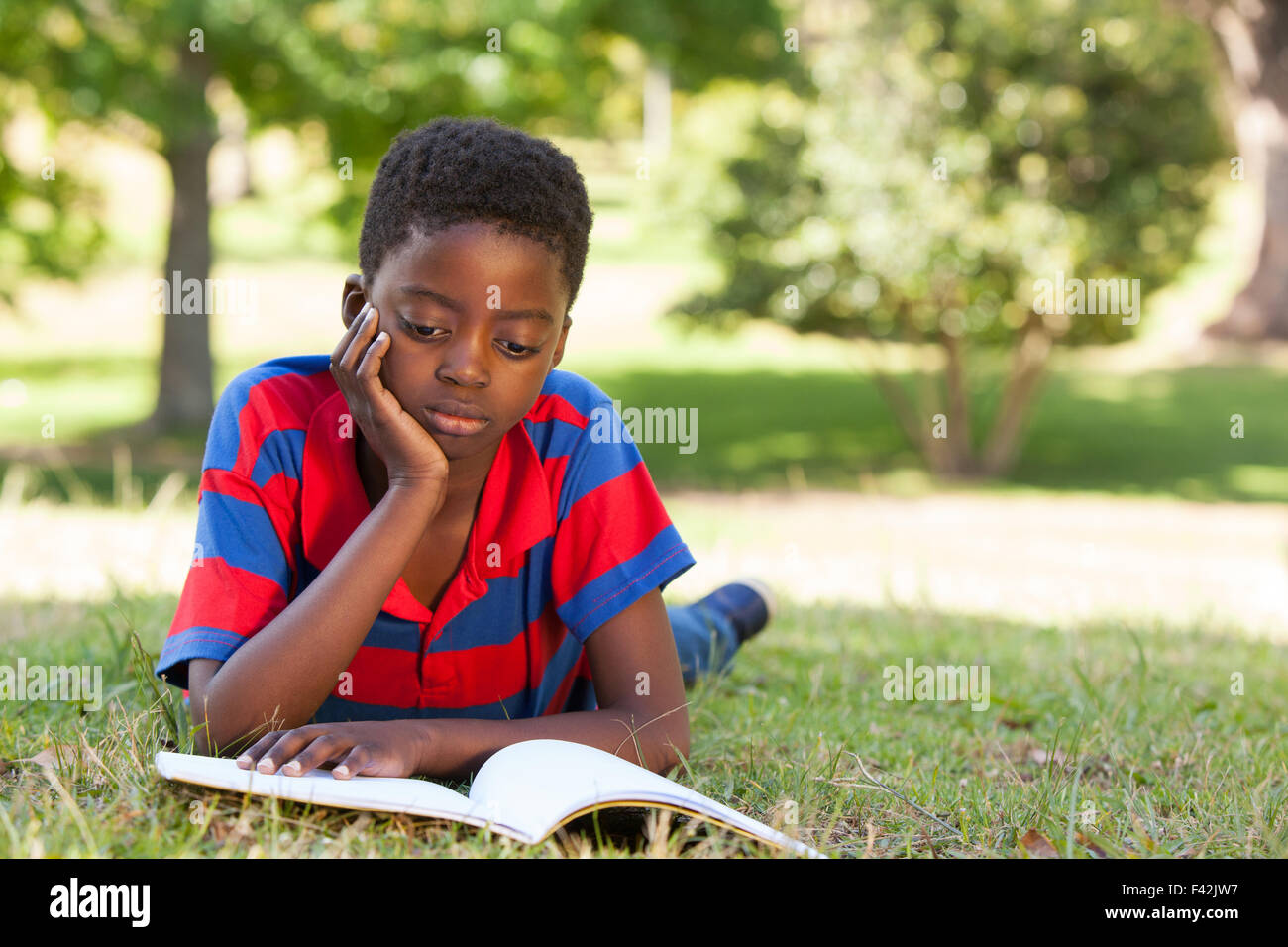 Thoughtful boy reading hi-res stock photography and images - Alamy