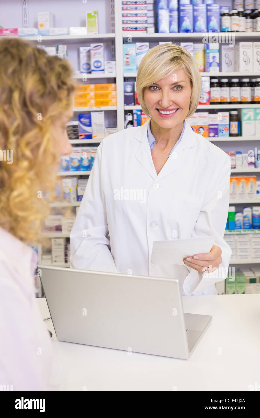 Pharmacist using the computer Stock Photo - Alamy