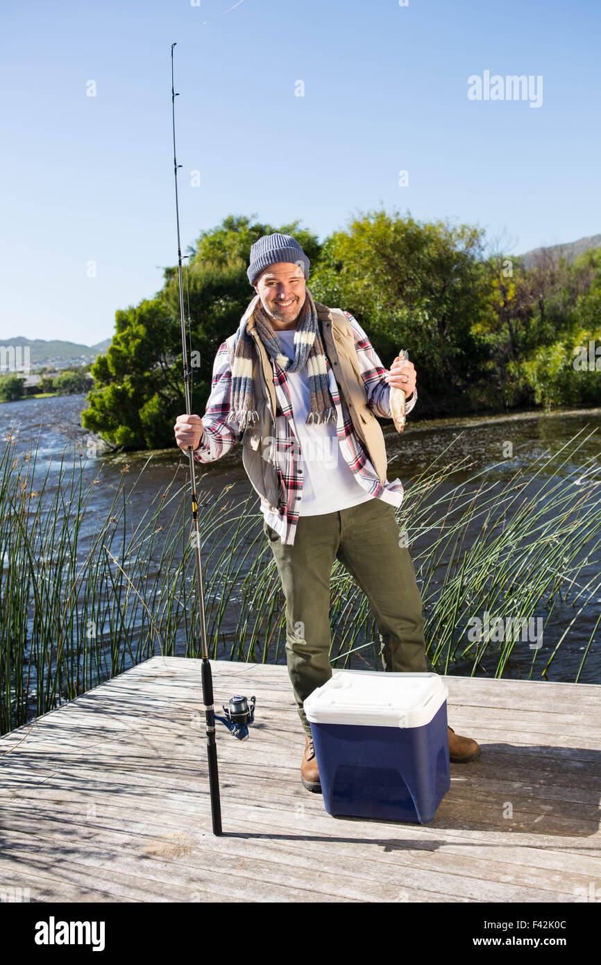 Happy man holding fish Stock Photo - Alamy