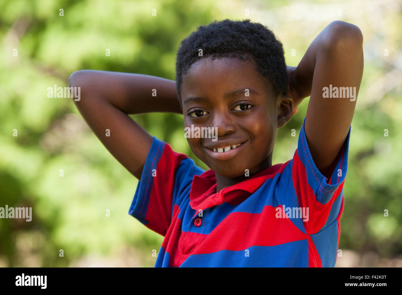 Cute little boy smiling at camera Stock Photo - Alamy