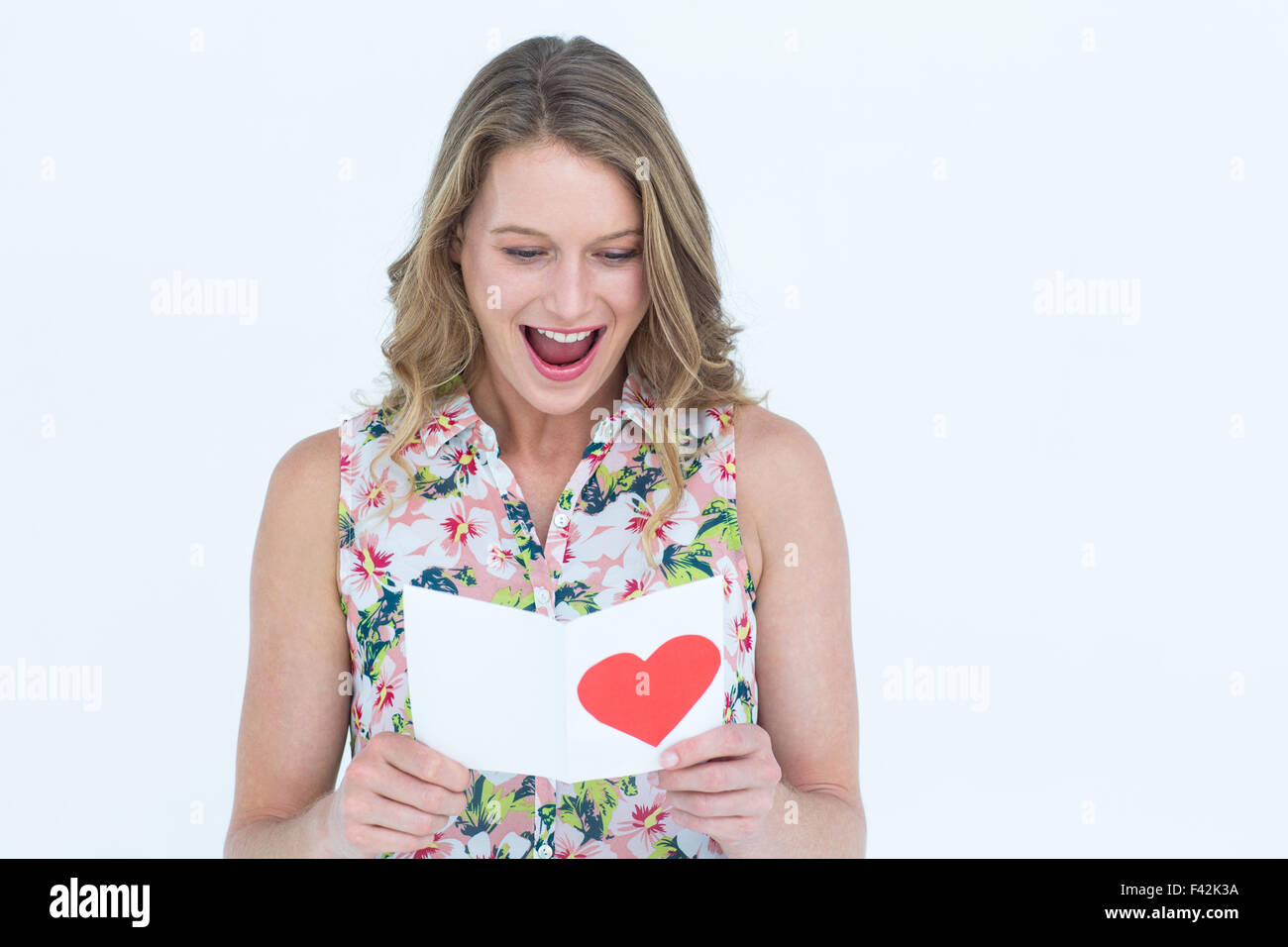 Surprised woman opening letter hi-res stock photography and images - Alamy