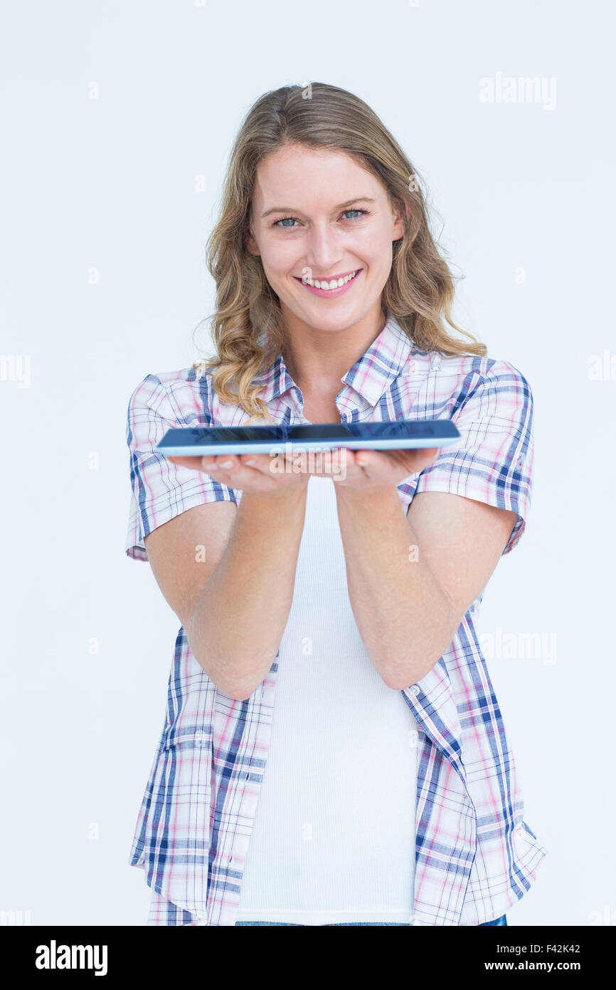 Pretty hipster showing tablet Stock Photo - Alamy
