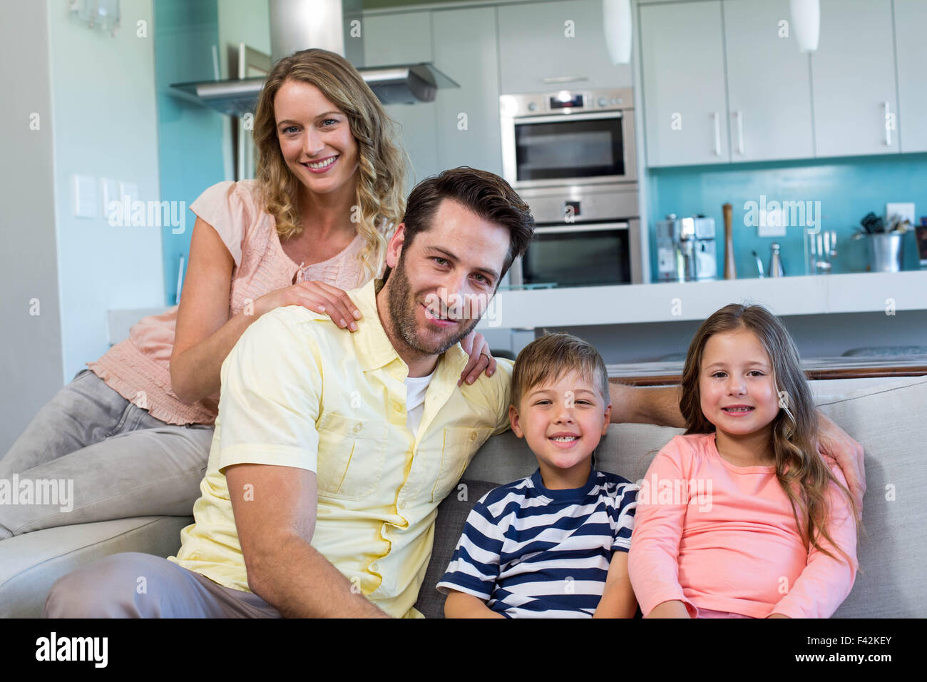 Happy family on the couch Stock Photo - Alamy