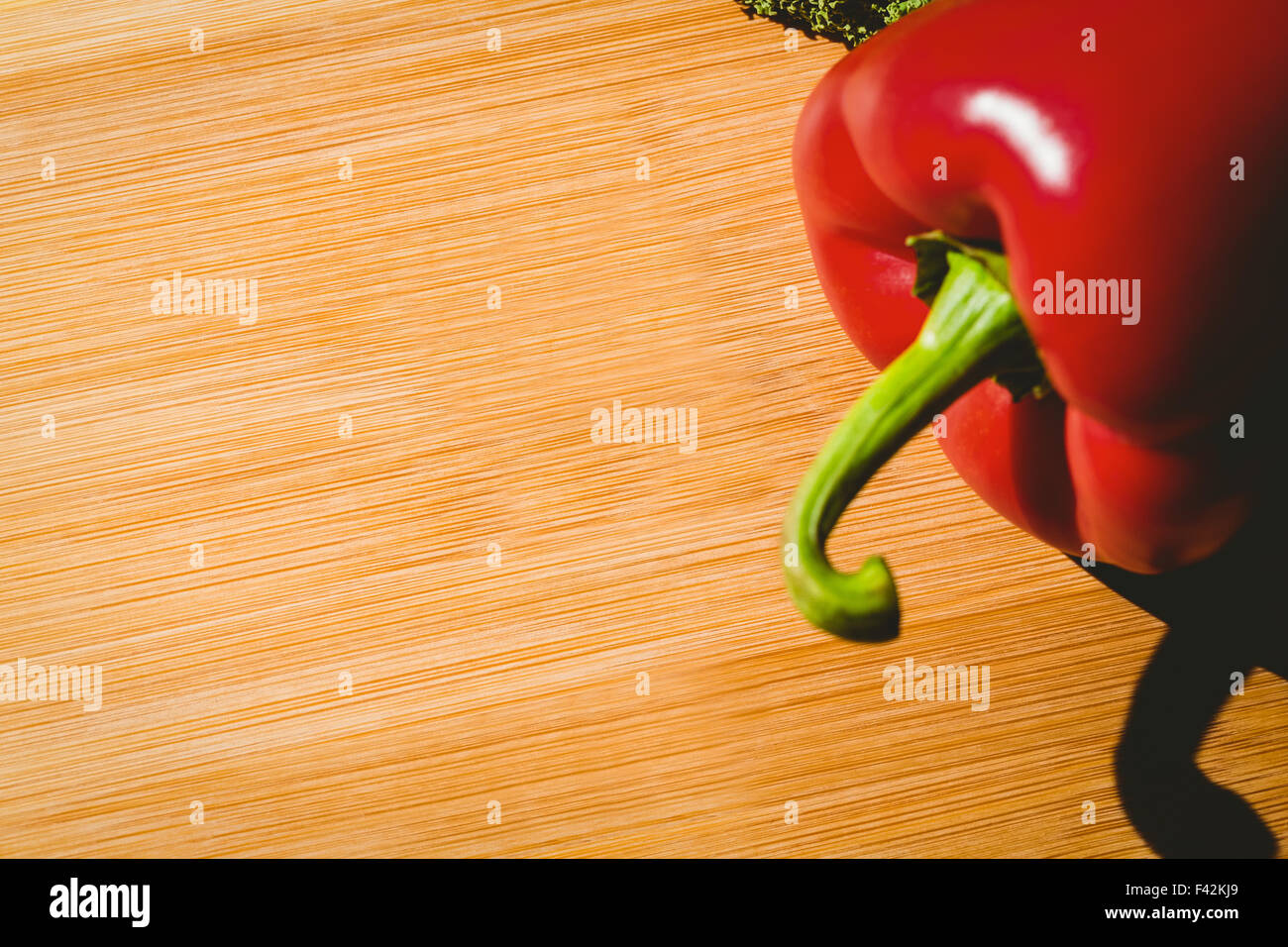Red pepper on chopping board Stock Photo - Alamy