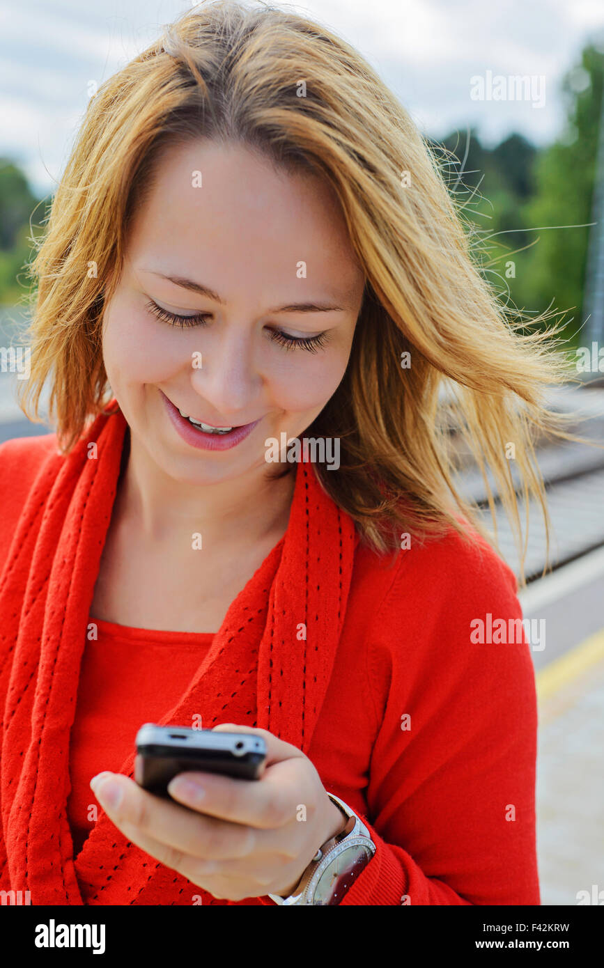 Young smiling girl with mobile hi-res stock photography and images - Alamy