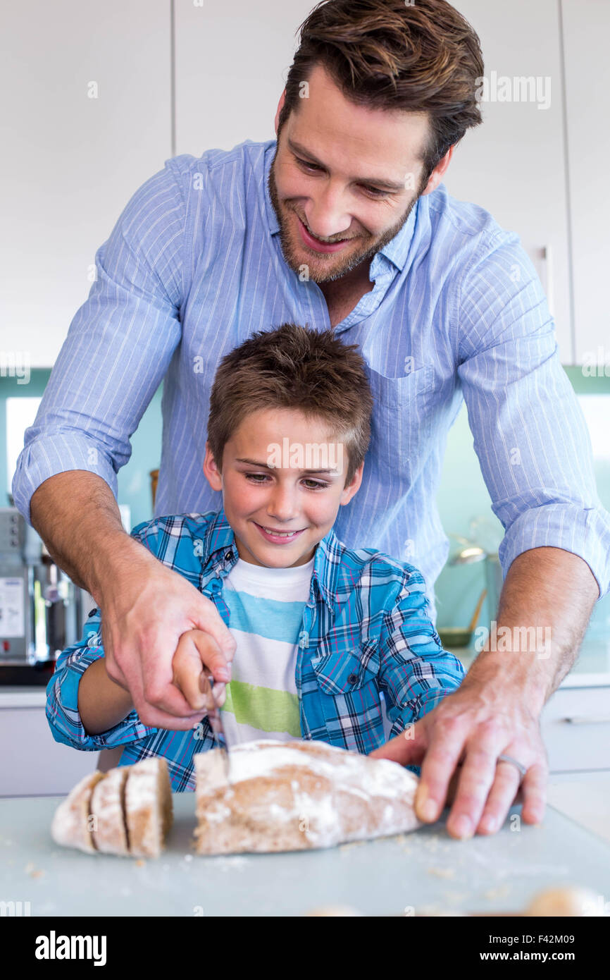 Happy family preparing lunch together Stock Photo - Alamy