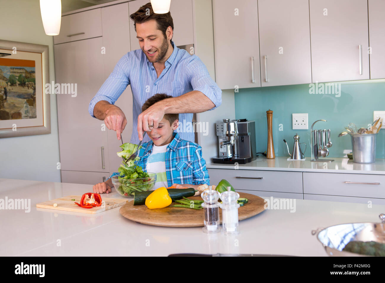 Portrait family preparing lunch hi-res stock photography and images - Alamy