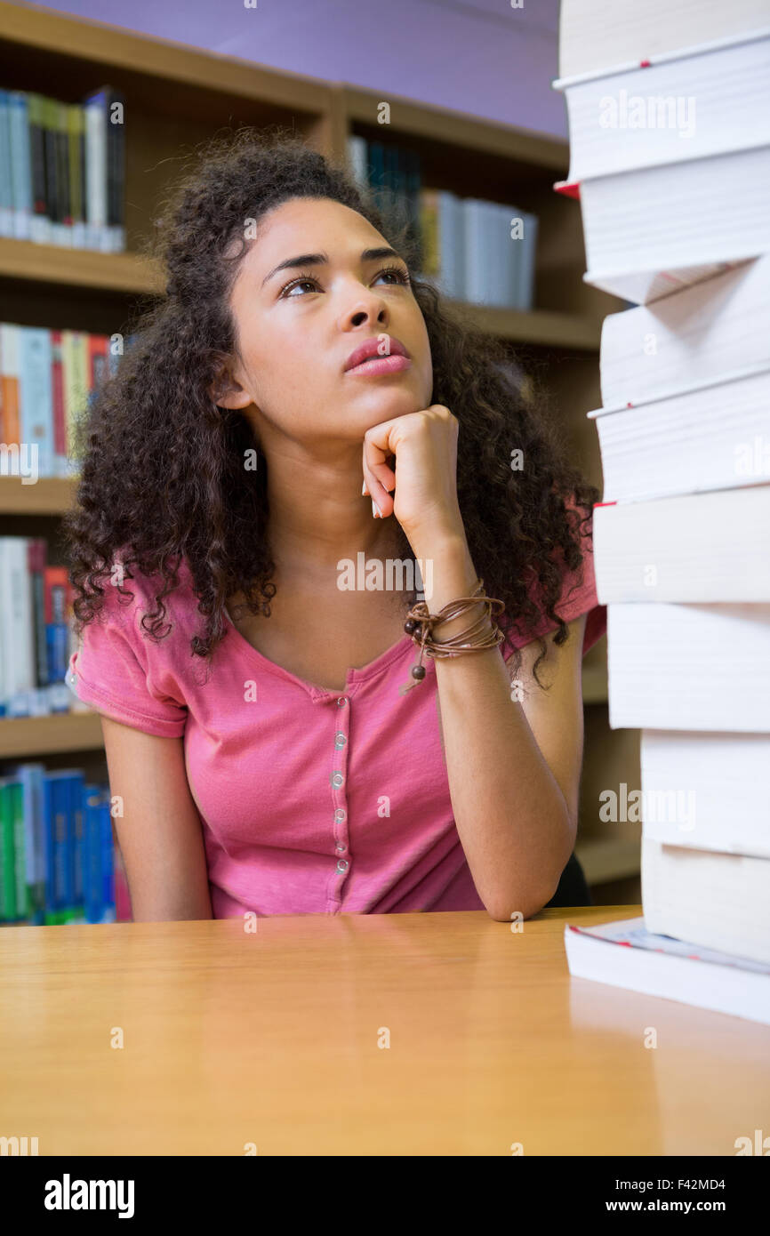 Pretty student studying in the library Stock Photo - Alamy