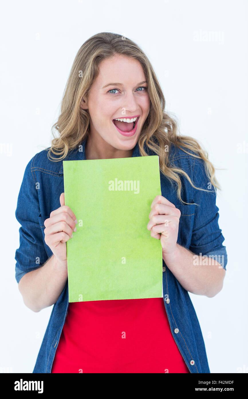 Smiling student holding notebook Stock Photo - Alamy
